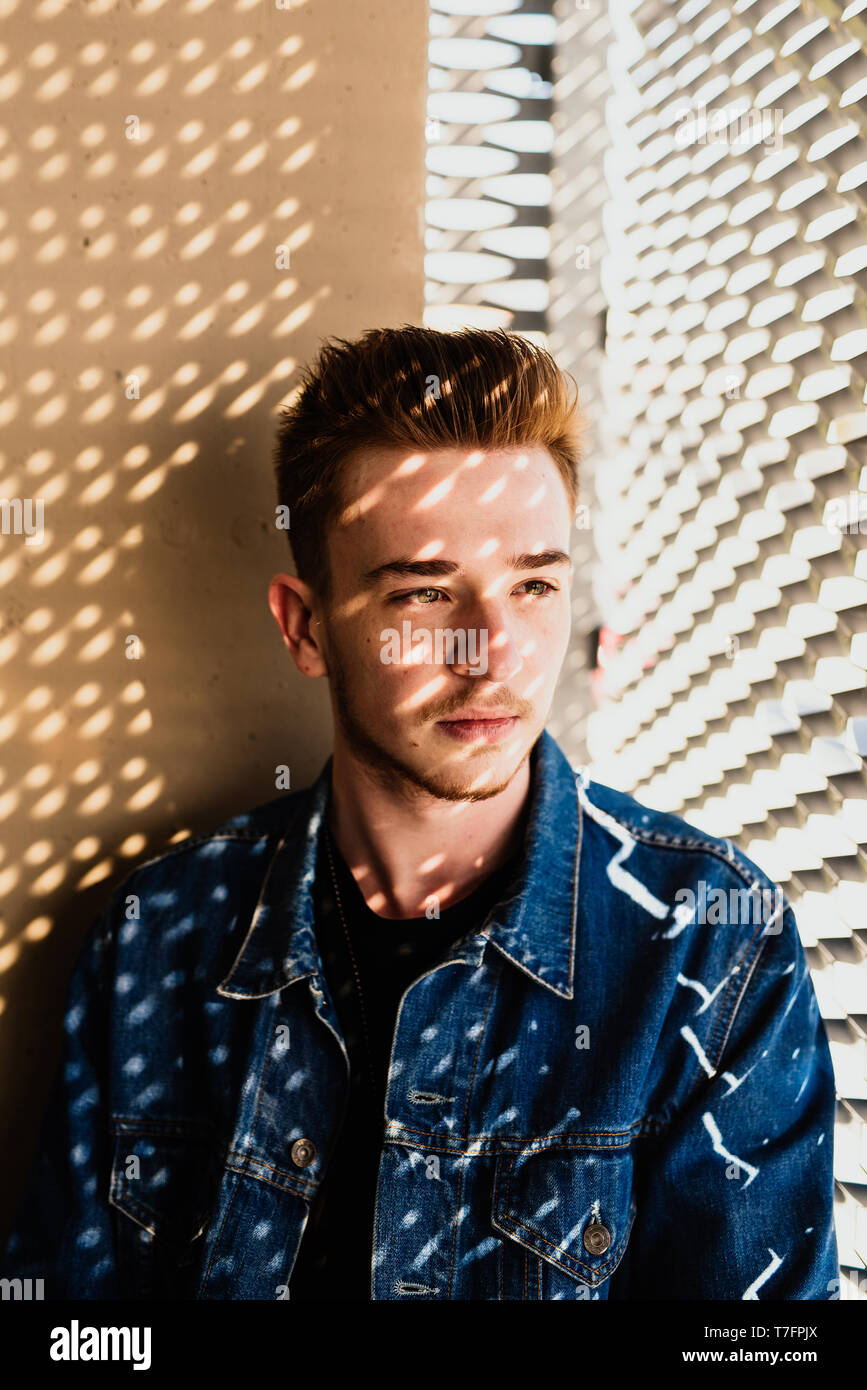 Young man with sunlight on his face Stock Photo - Alamy