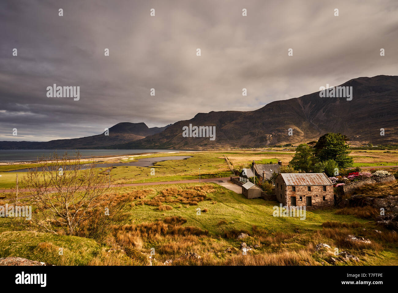 Small cottage with red roof beside Loch Shieldaig in Torridon, on North ...