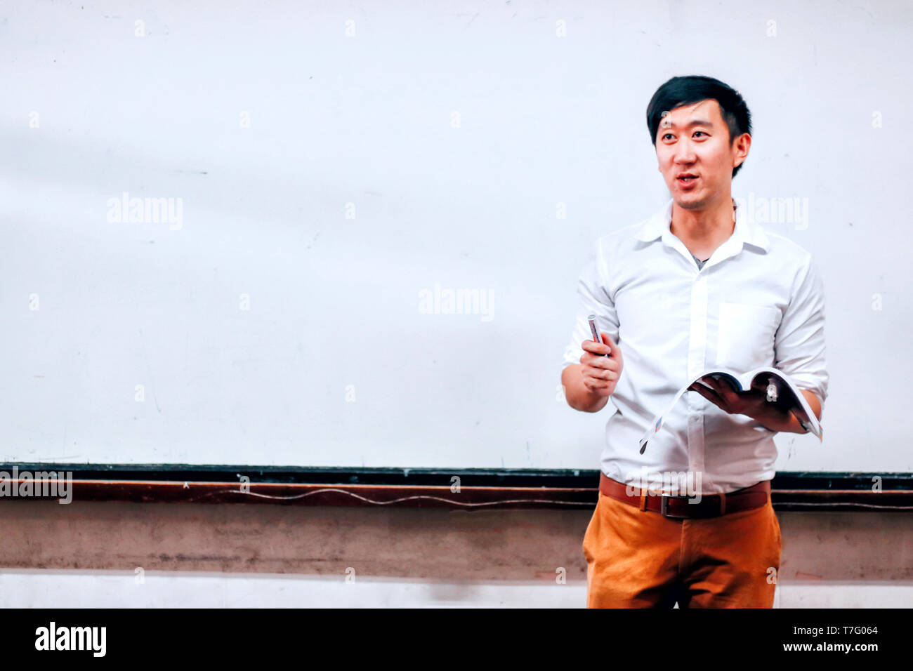 Asian man teacher classroom hi-res stock photography and images - Alamy