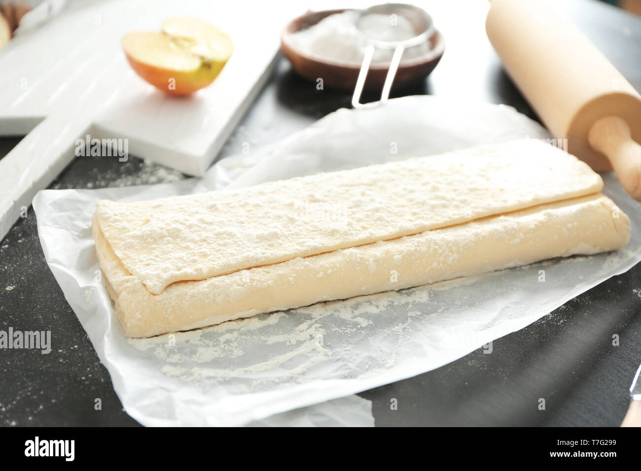 Fresh raw puff dough on table Stock Photo - Alamy