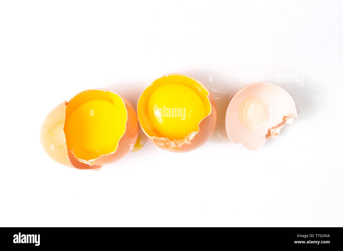 Broken chicken eggs isolated on white background Stock Photo - Alamy