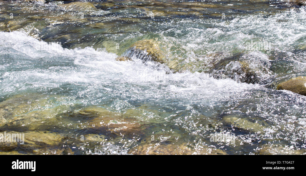 Water in the mountain raging river. Beautiful natural background of ...