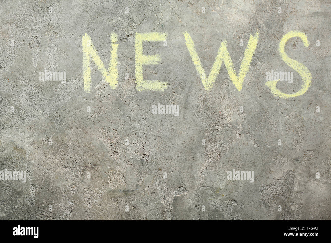 Word NEWS written on grey background Stock Photo - Alamy