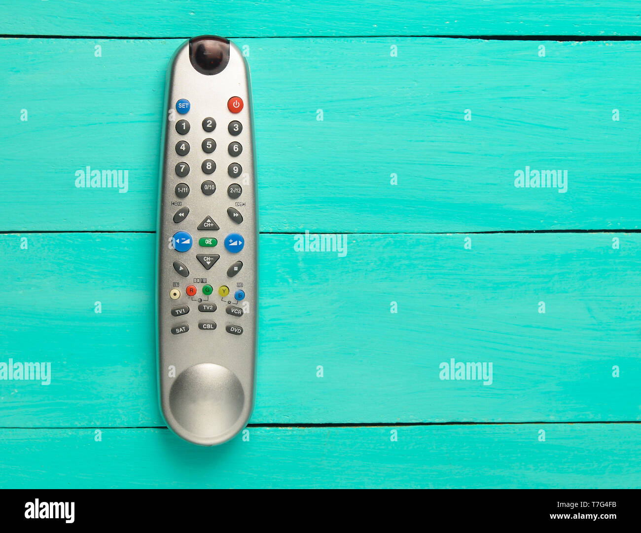 The TV remote control on a blue wooden background. Top view Stock Photo ...