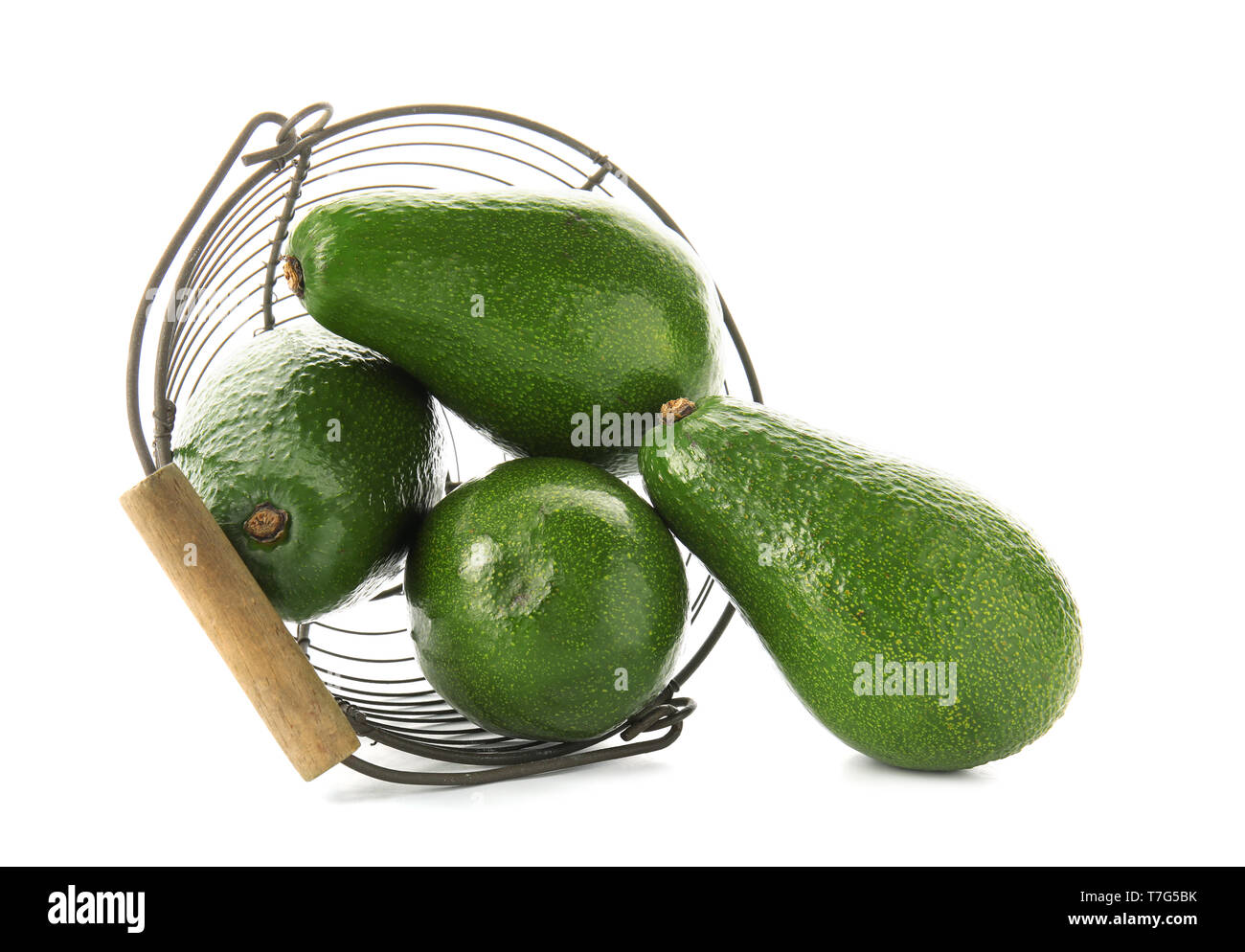 Metal basket with fresh avocados on white background Stock Photo - Alamy