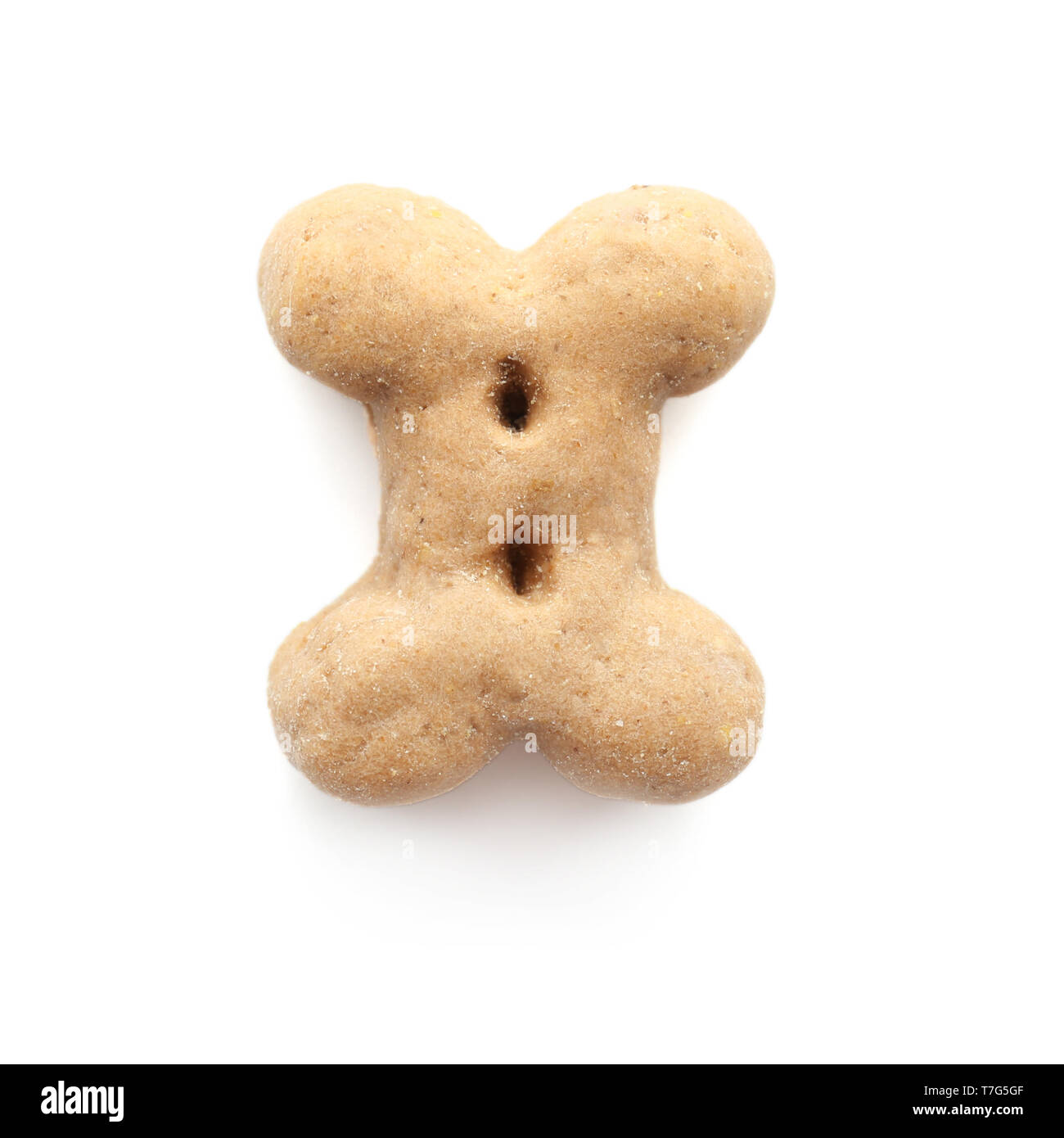 Dry pet food in shape of bone on white background Stock Photo - Alamy