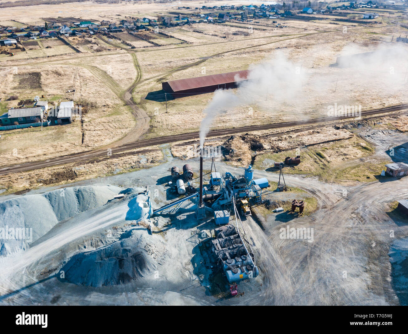 Aerial view of a small plant for the production and cleaning rubble and ...