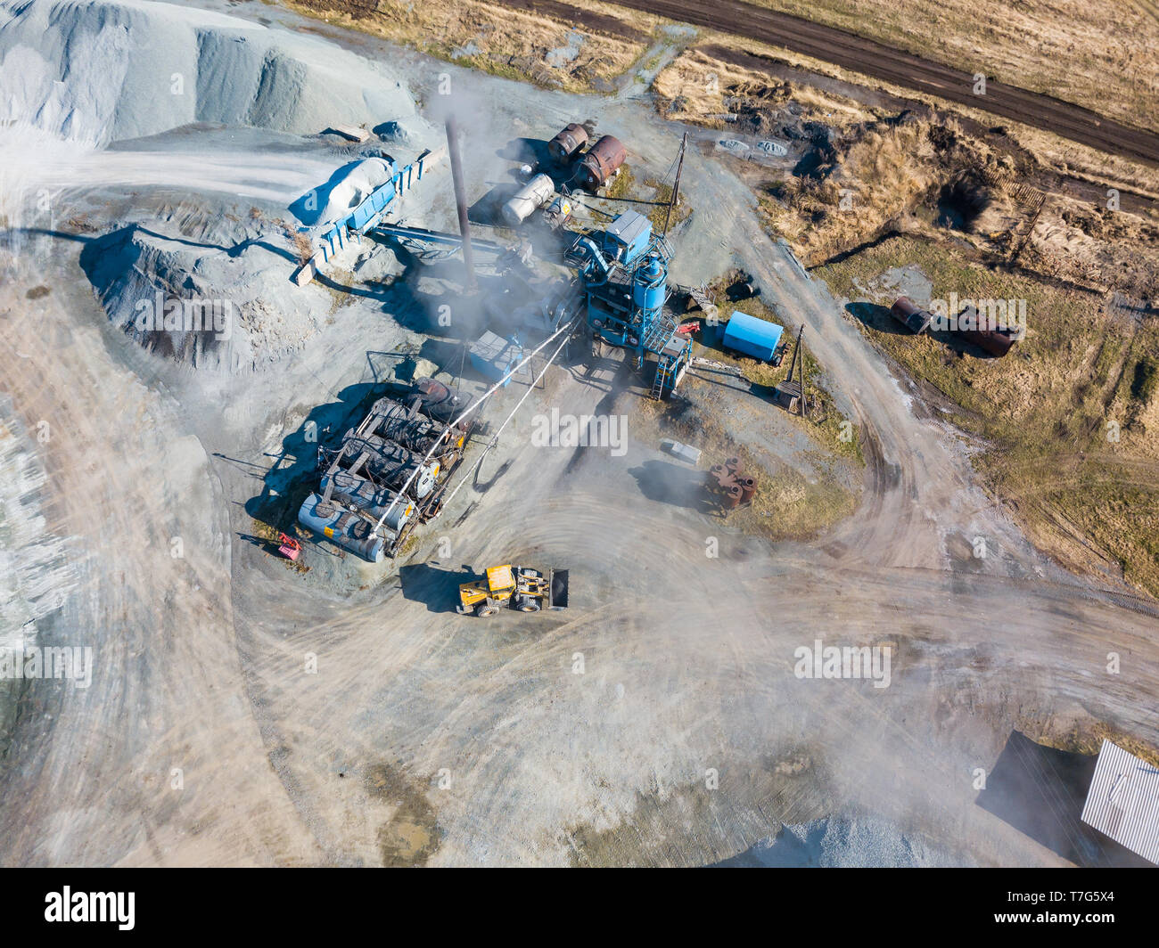 Aerial view of a small plant for the production and cleaning rubble and ...