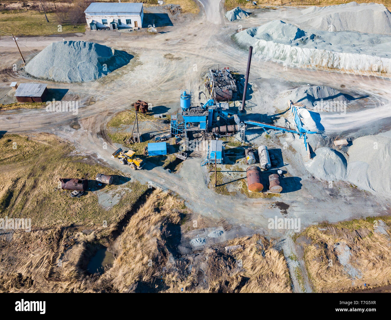 Aerial view of a small plant for the production and cleaning rubble and ...