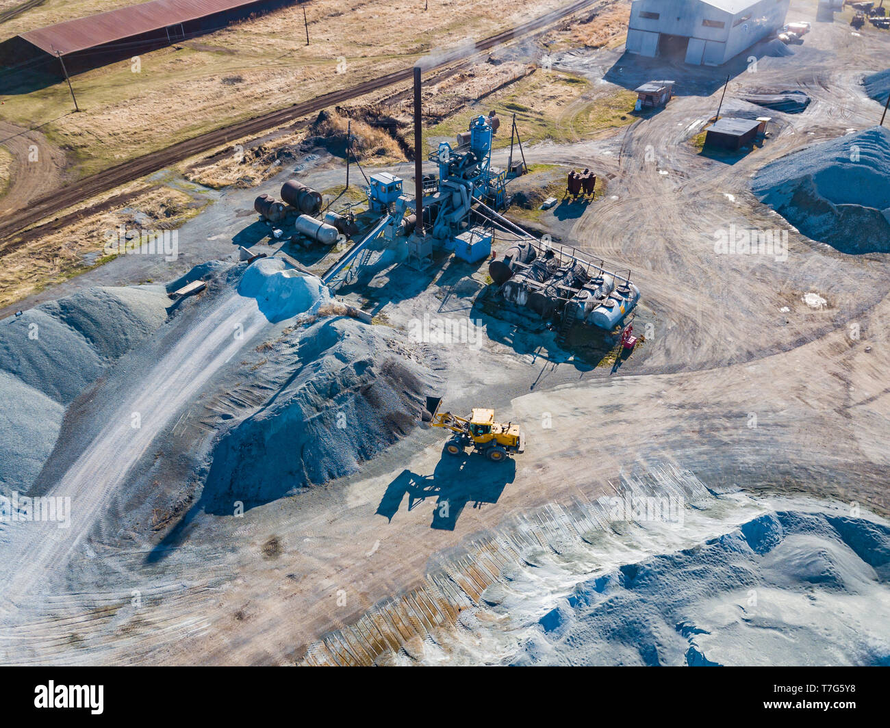 Aerial view of a small plant for the production and cleaning rubble and ...