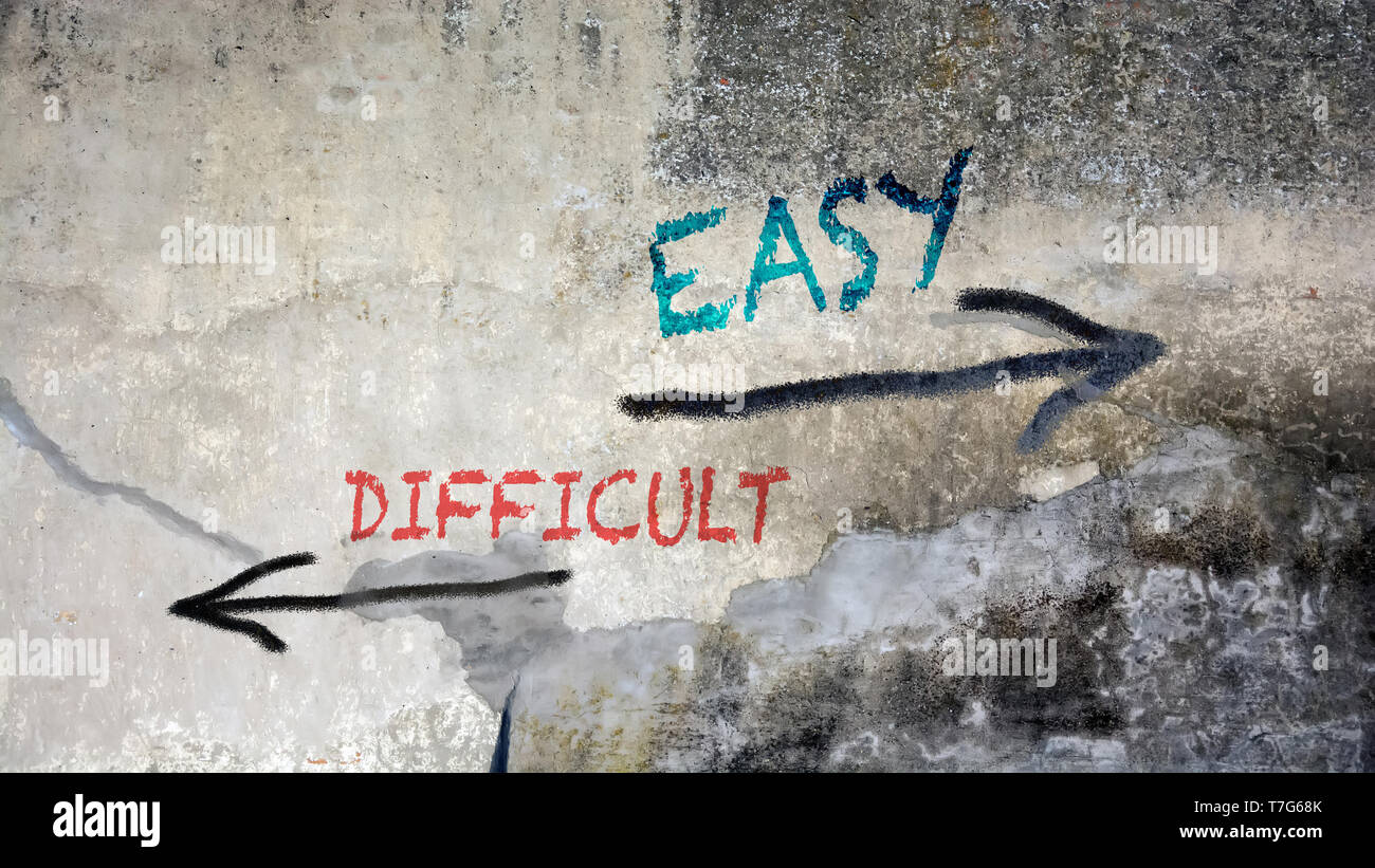 Wall Graffiti the Direction Way to Easy versus Difficult Stock Photo ...