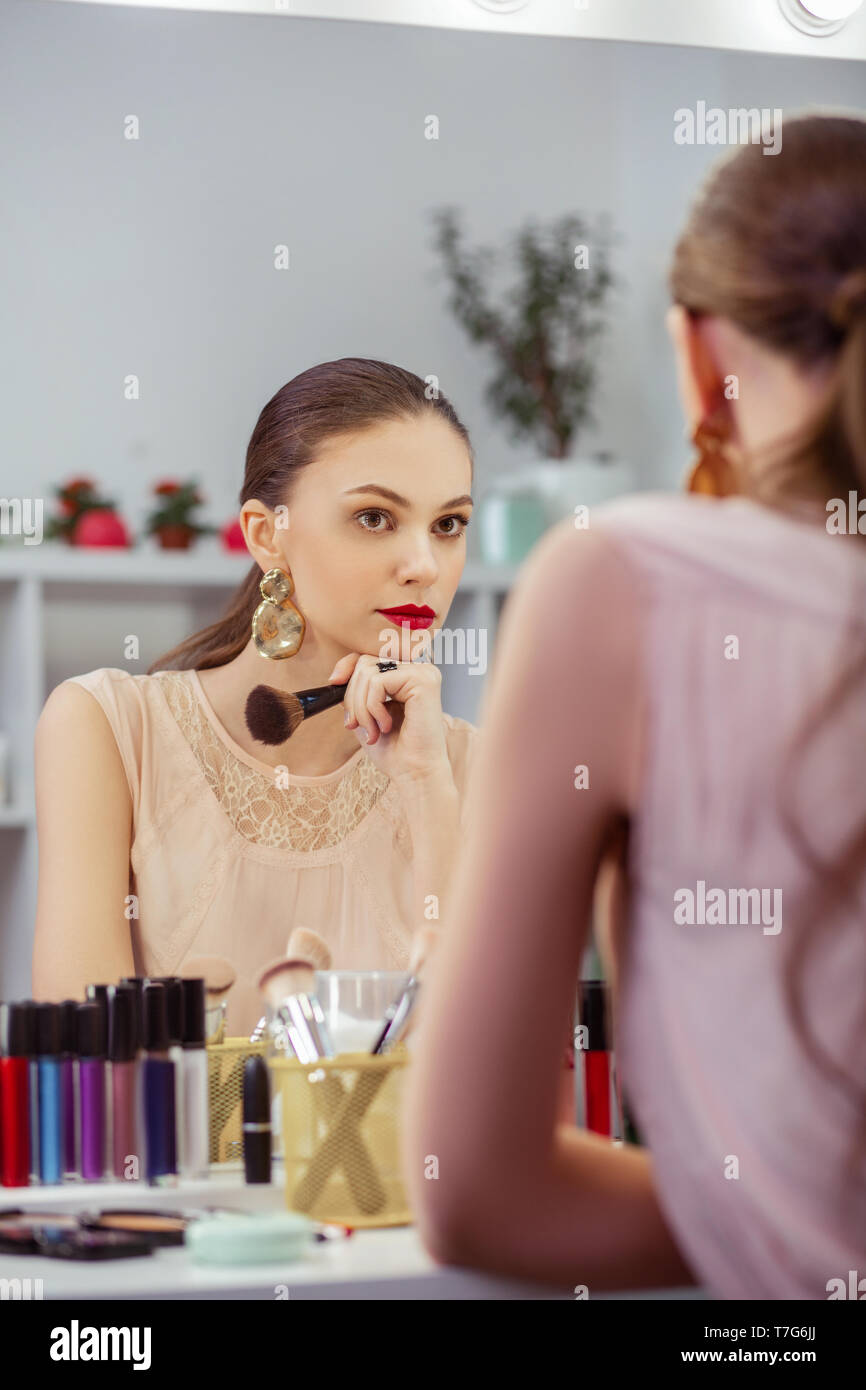 Nice magnetic woman thinking about her appearance Stock Photo - Alamy