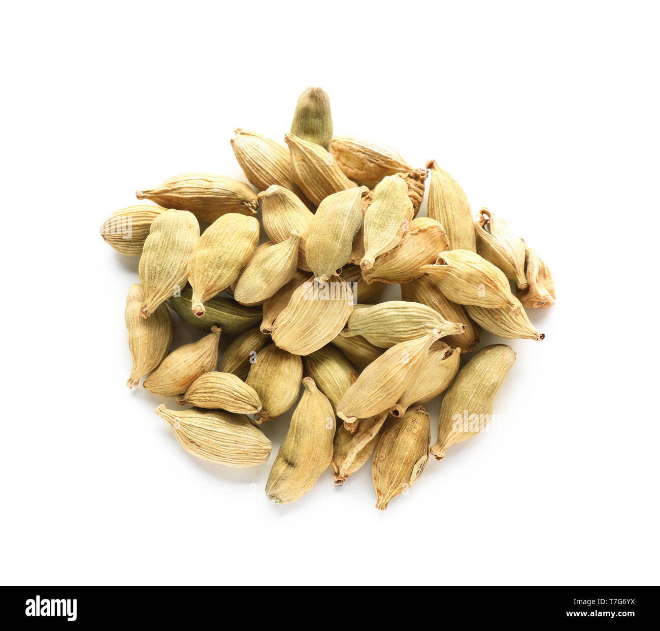 Cardamon pods on white background Stock Photo - Alamy