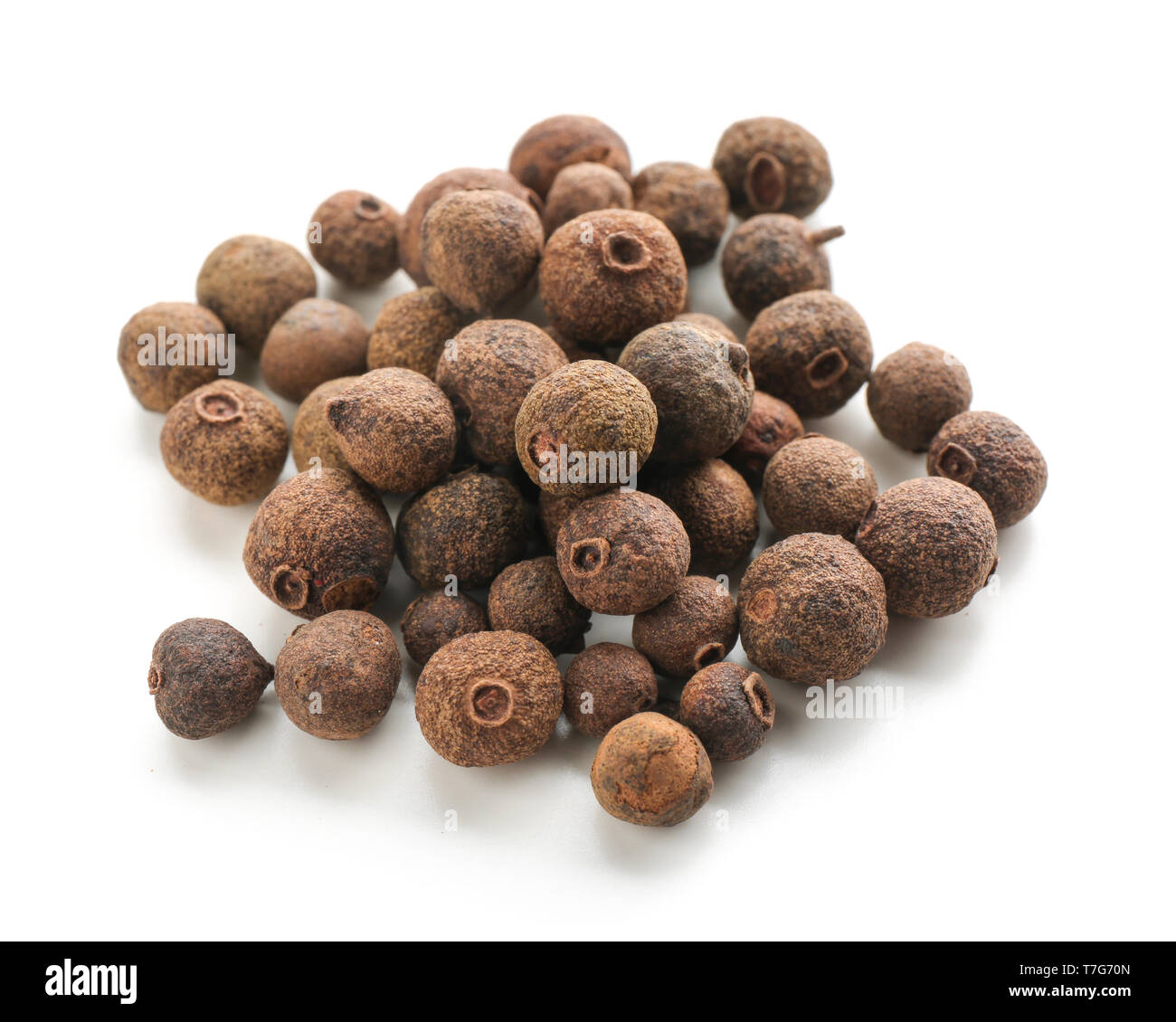 Allspice pepper on white background Stock Photo - Alamy