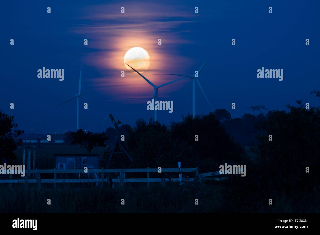 Wind farm at night in Germany. With setting moon in background Stock ...