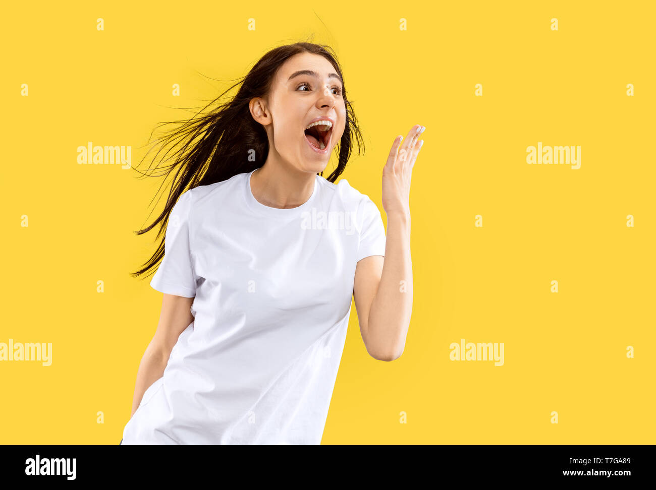 Happy smiling and screaming girl. Beautiful female half-length portrait ...