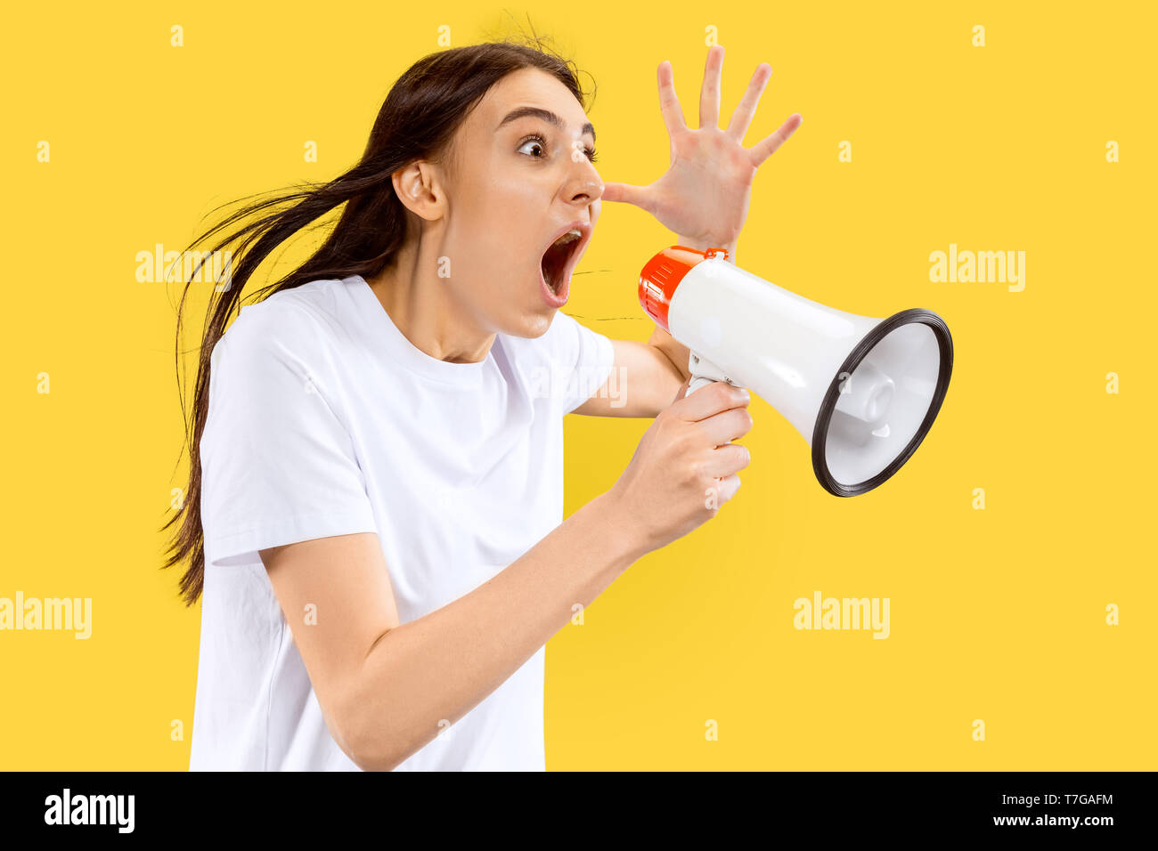 Screaming girl with the mouthpiece. Beautiful female half-length ...
