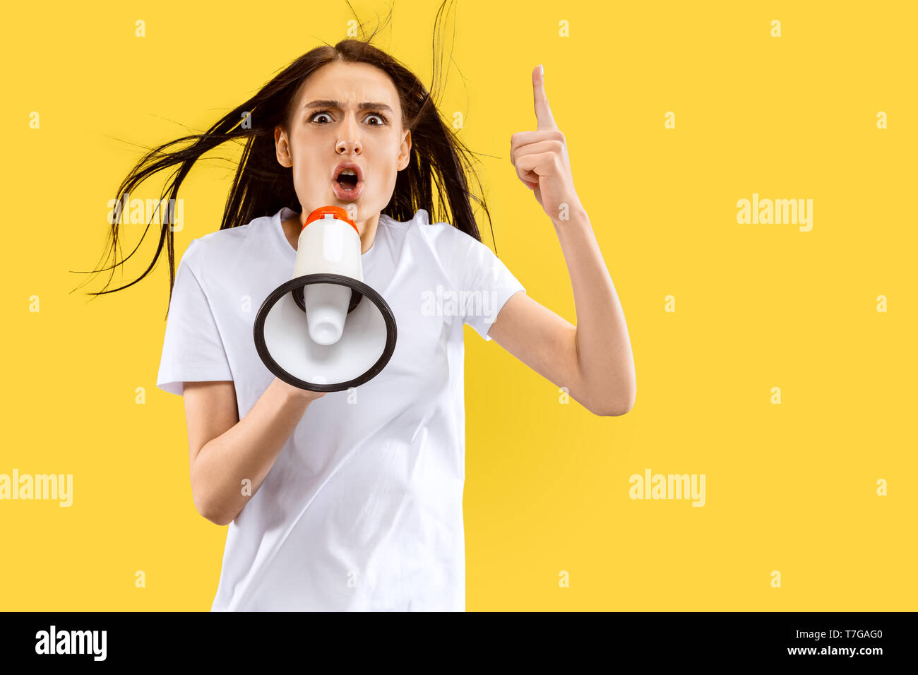 Screaming girl with the mouthpiece. Beautiful female half-length ...