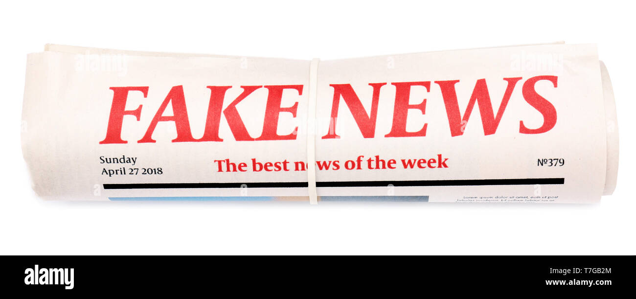 Rolled newspaper with headline FAKE NEWS on white background Stock ...