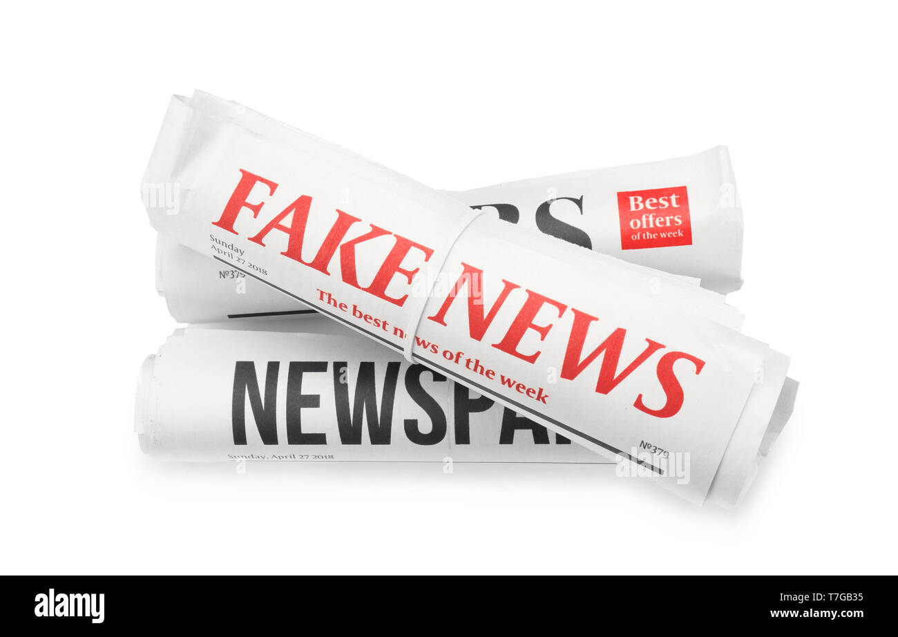 Rolled newspapers on white background Stock Photo - Alamy