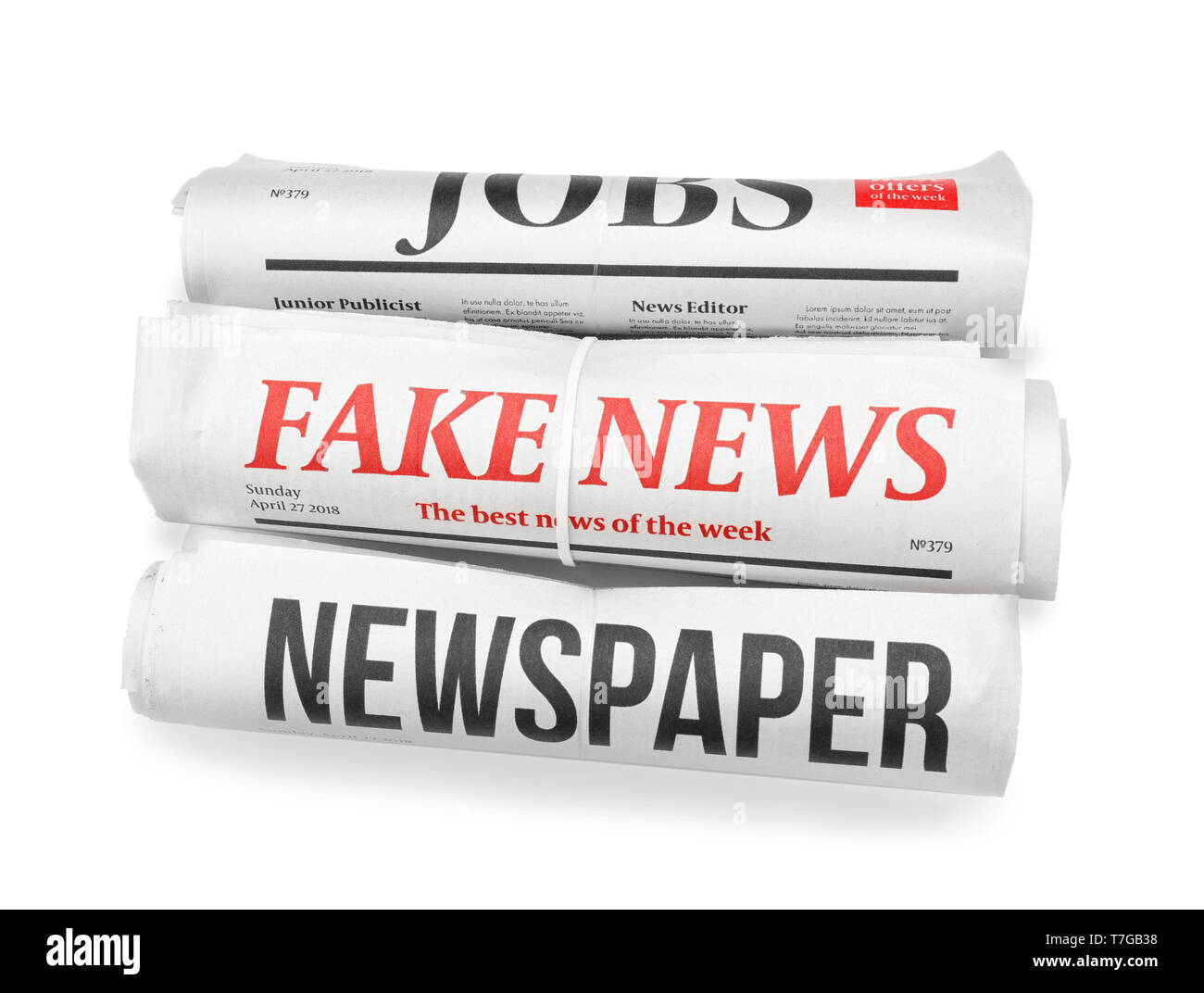 Rolled newspapers on white background Stock Photo - Alamy