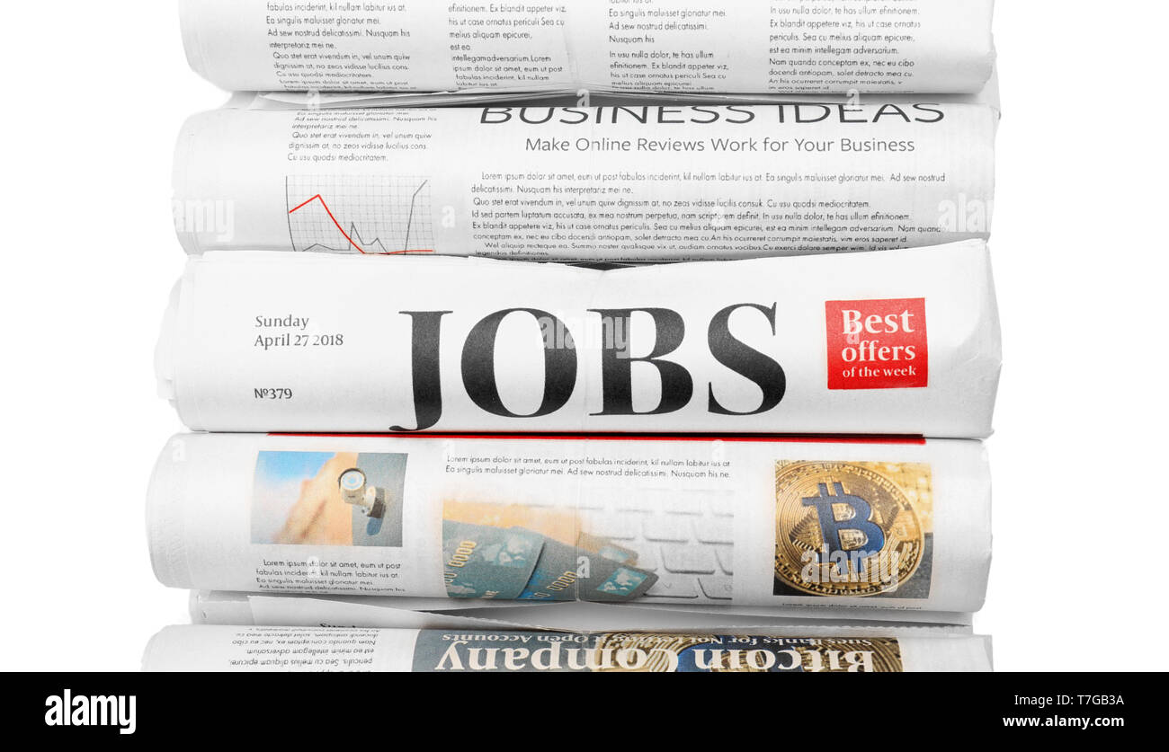 Rolled newspapers on white background Stock Photo - Alamy