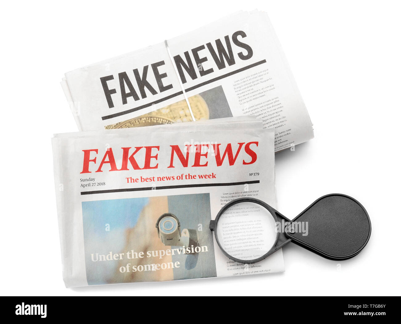 Magnifying glass with newspapers on white background Stock Photo - Alamy