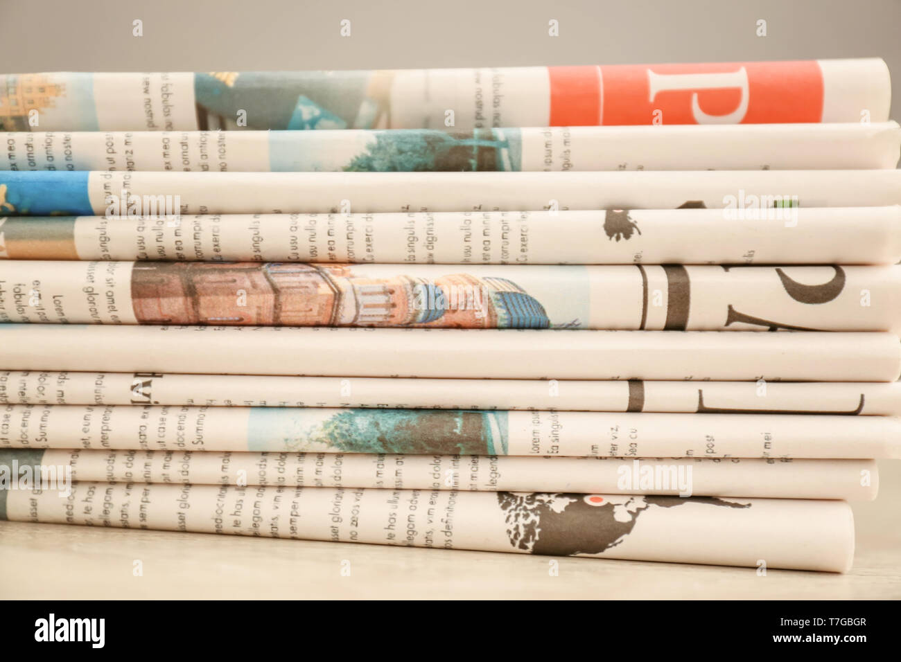 Pile of newspapers table, closeup Stock Photo - Alamy