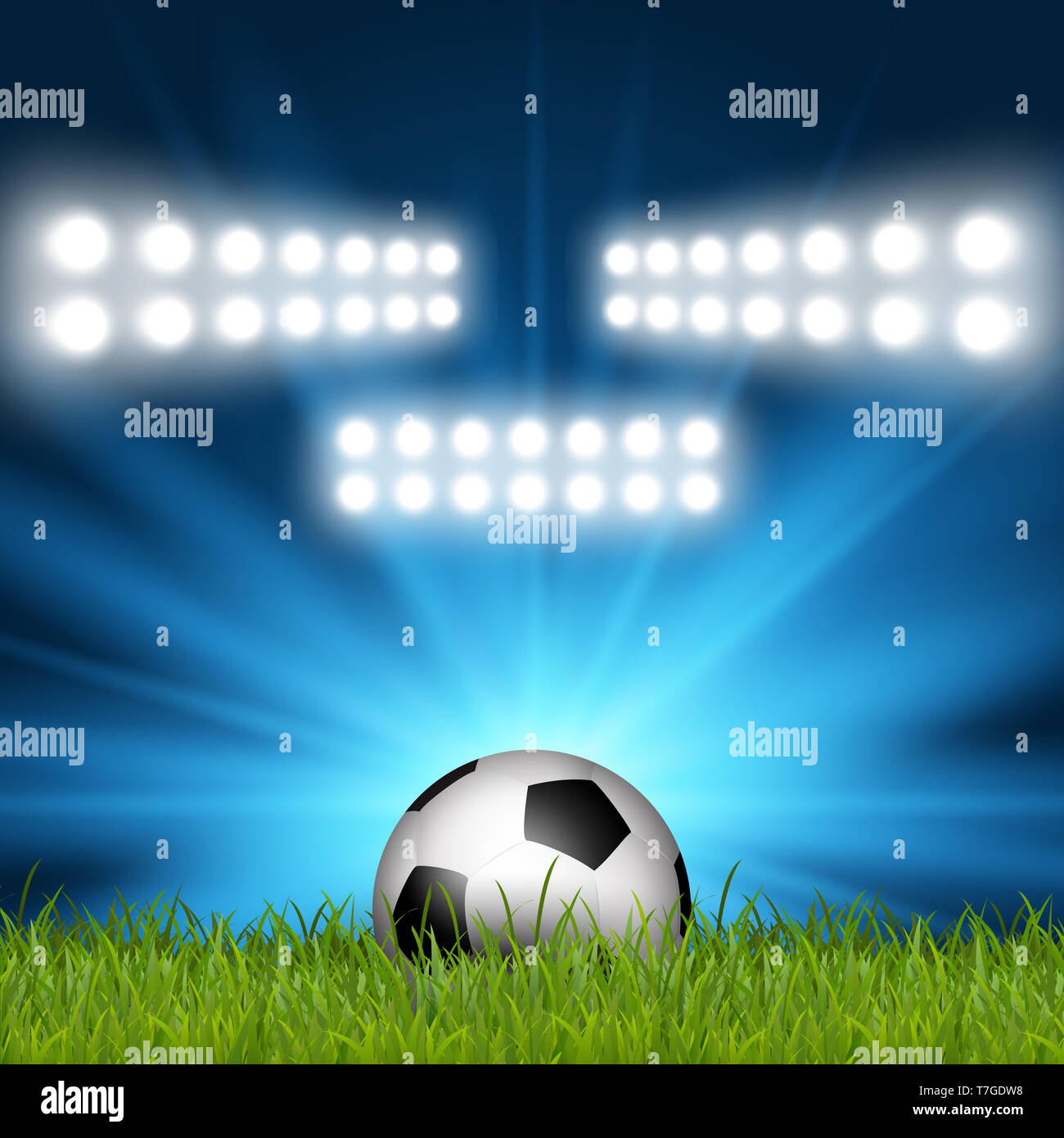 Football / soccer ball under spotlights nestled in grass Stock Photo ...