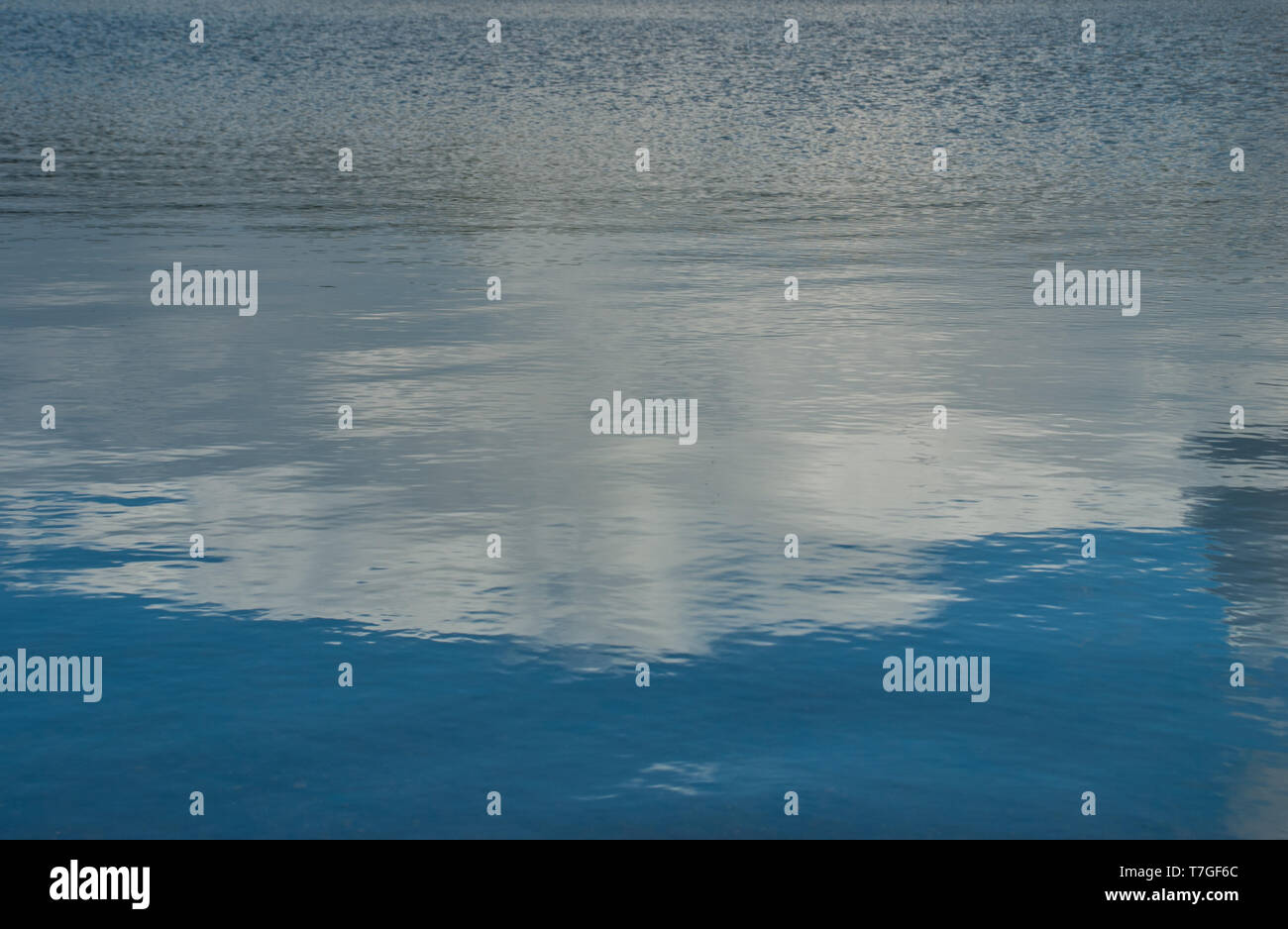 The background of the sea with the reflection of the sky and beautiful ...
