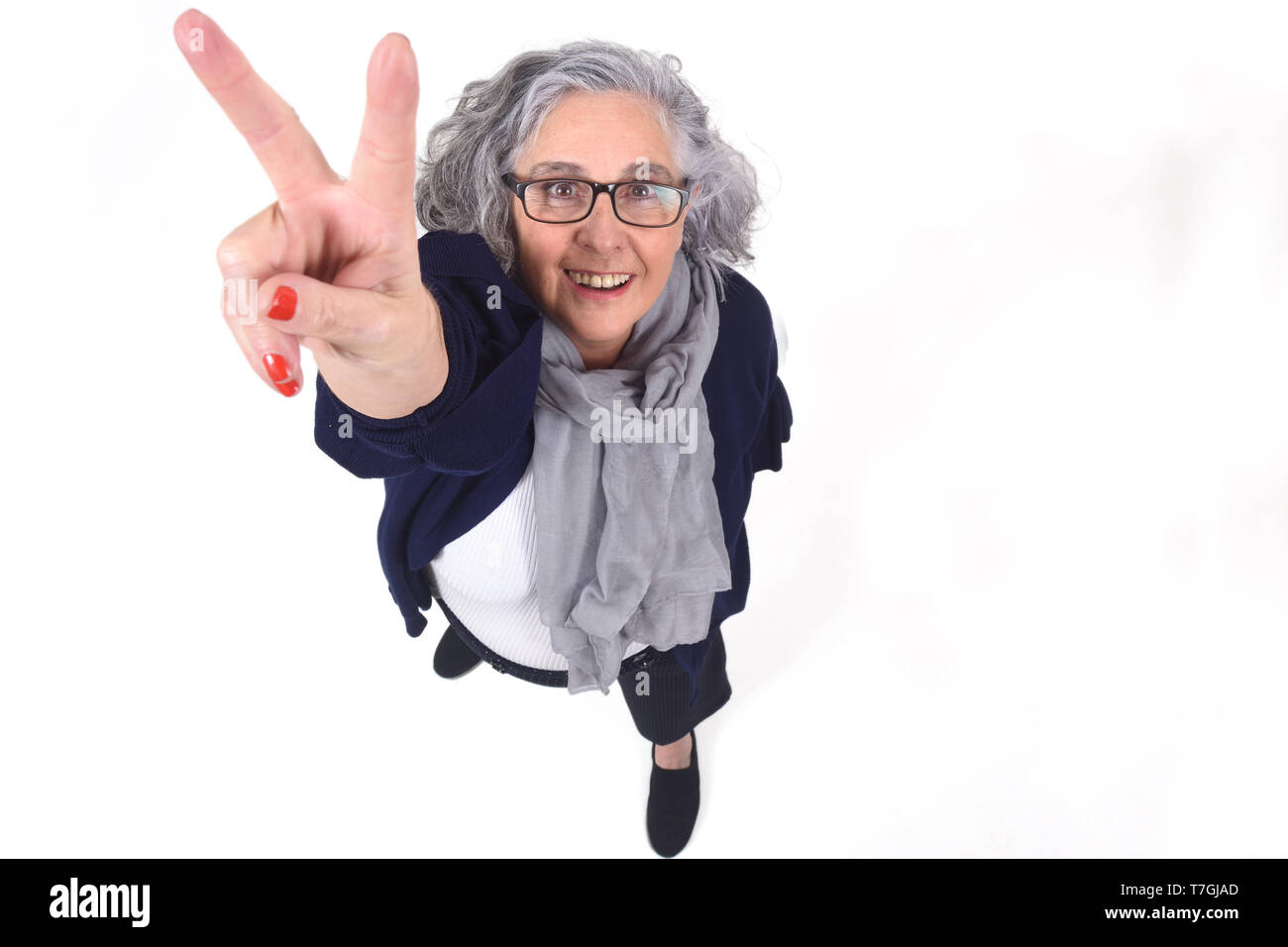 woman making the victory sign on a white background Stock Photo - Alamy