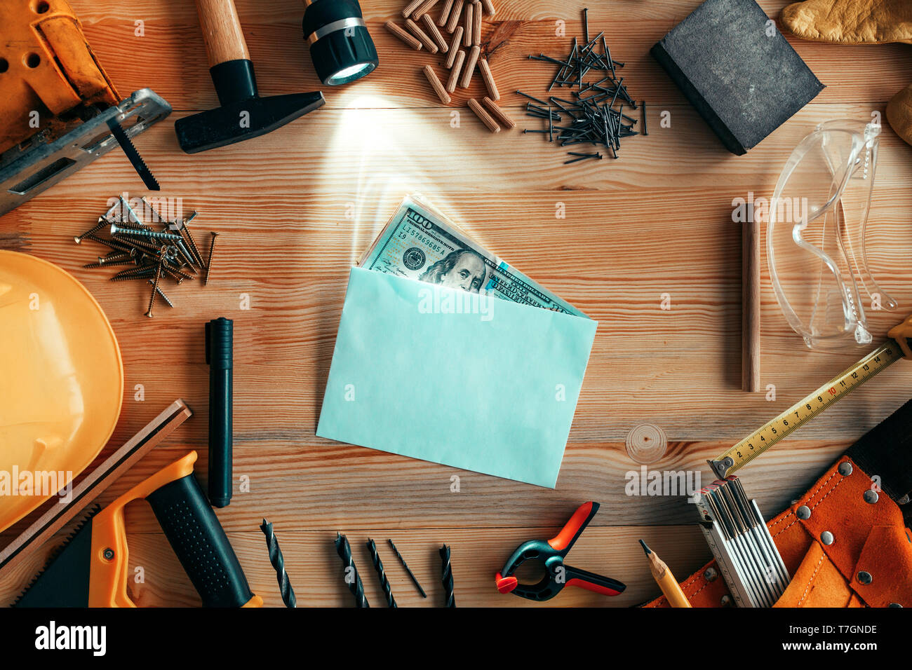 Money in envelope on carpentry woodwork workshop desk, top view Stock ...