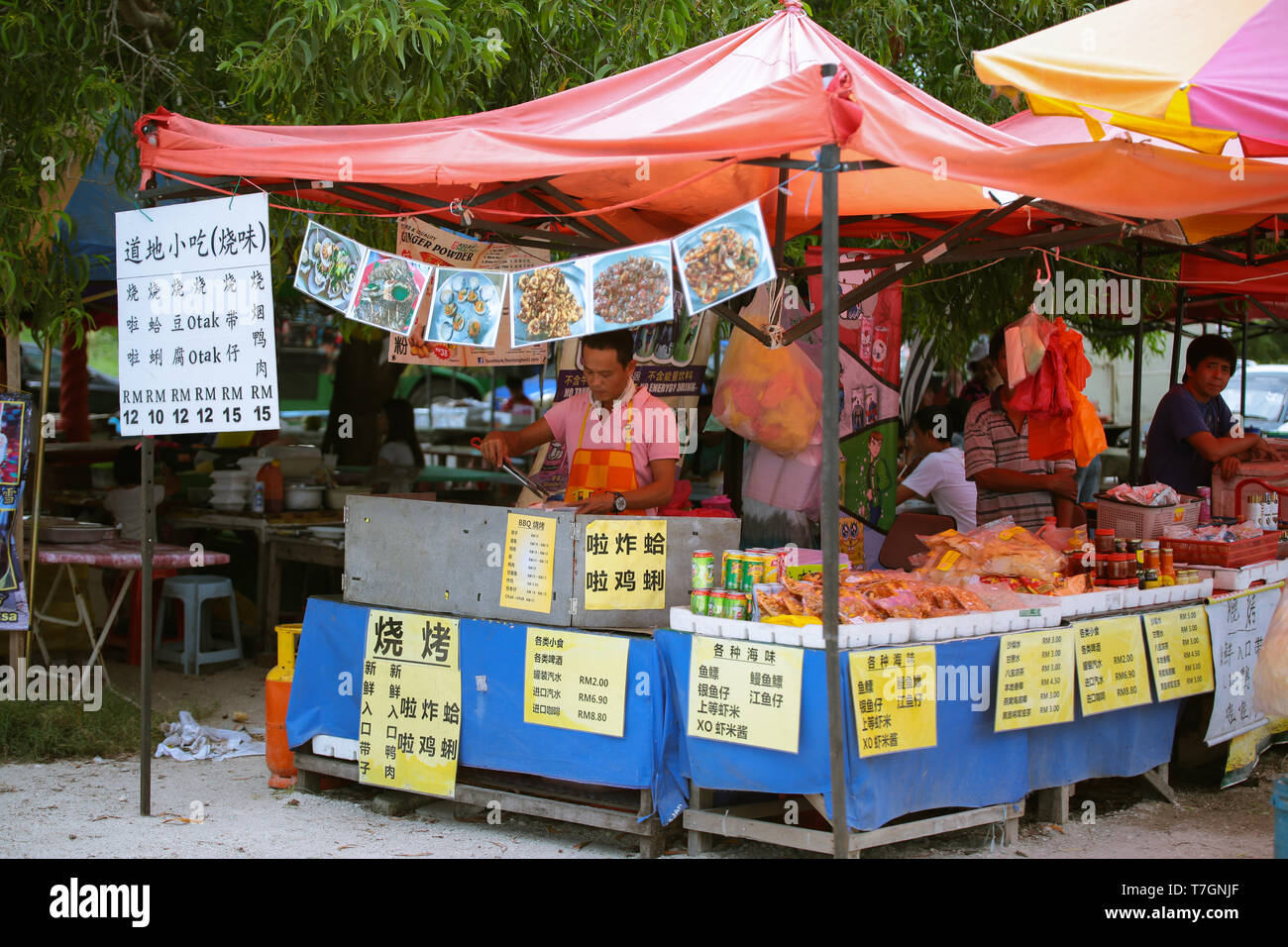 Food stall selling local seafood delicacy and other titbit snacks Stock ...