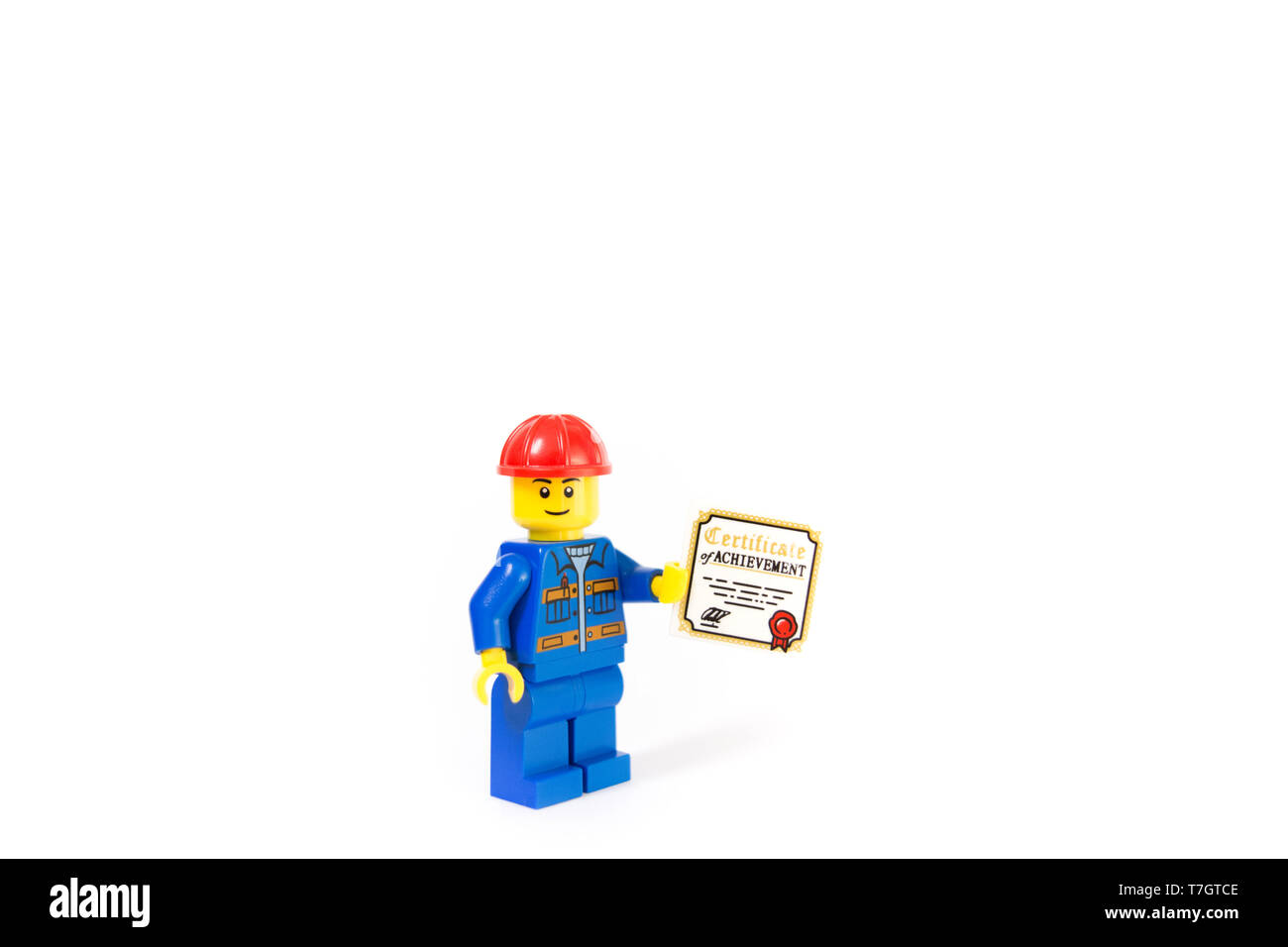 Construction worker holding a certificate of achievement Stock Photo ...