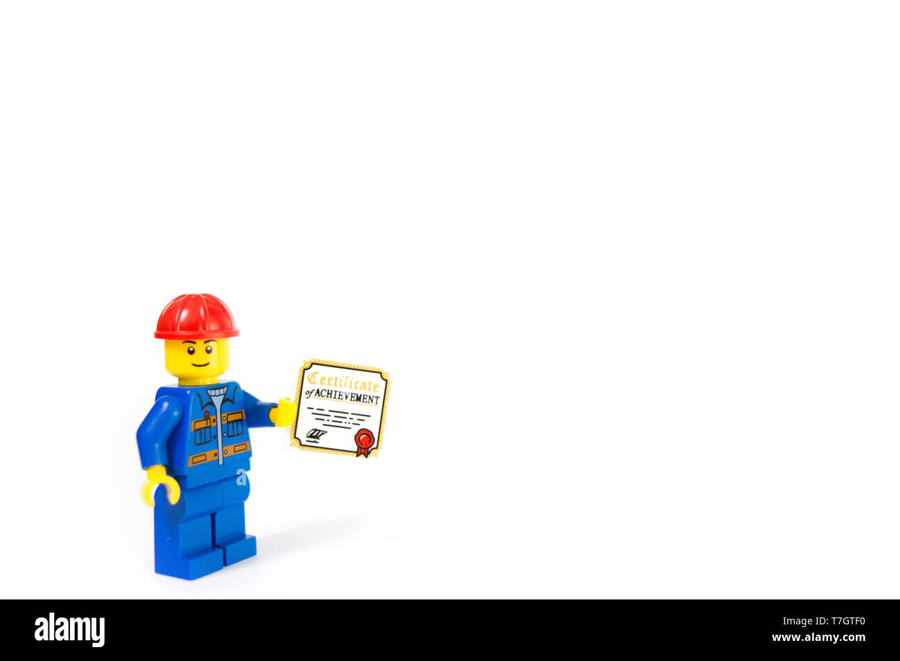Construction worker holding a certificate of achievement Stock Photo ...