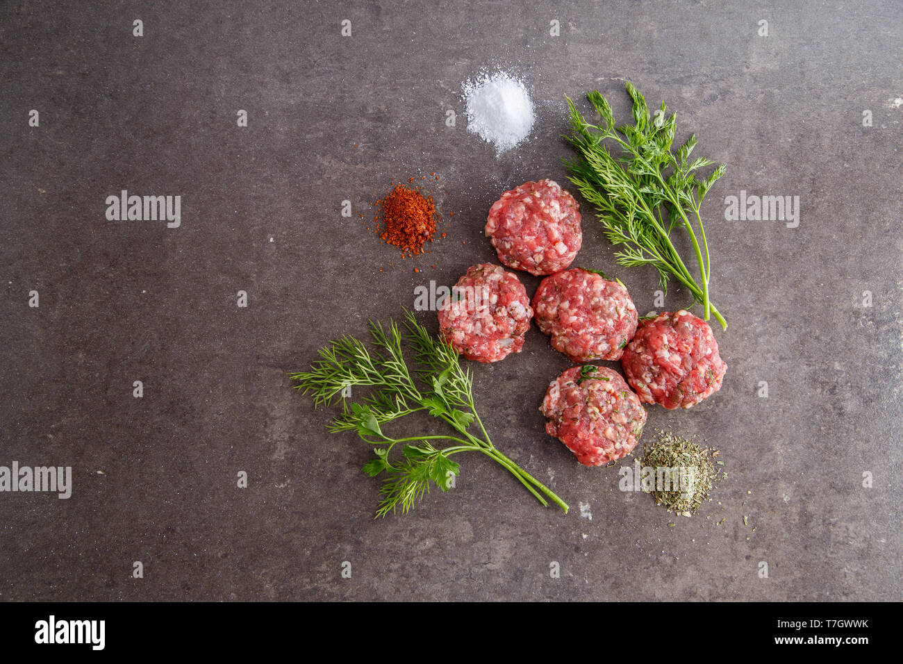 minced meat on a grey background Stock Photo - Alamy