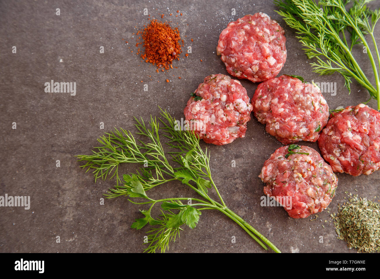 minced meat on a grey background Stock Photo - Alamy
