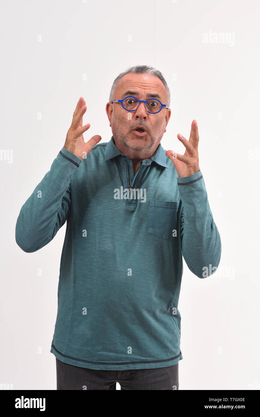 man with expression of forgetfulness or surprise on white background ...