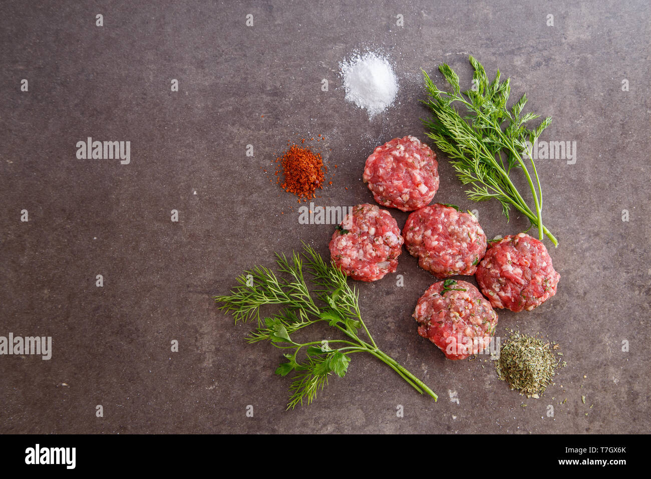 minced meat on a grey background Stock Photo - Alamy