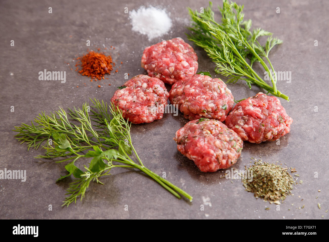 minced meat on a grey background Stock Photo - Alamy