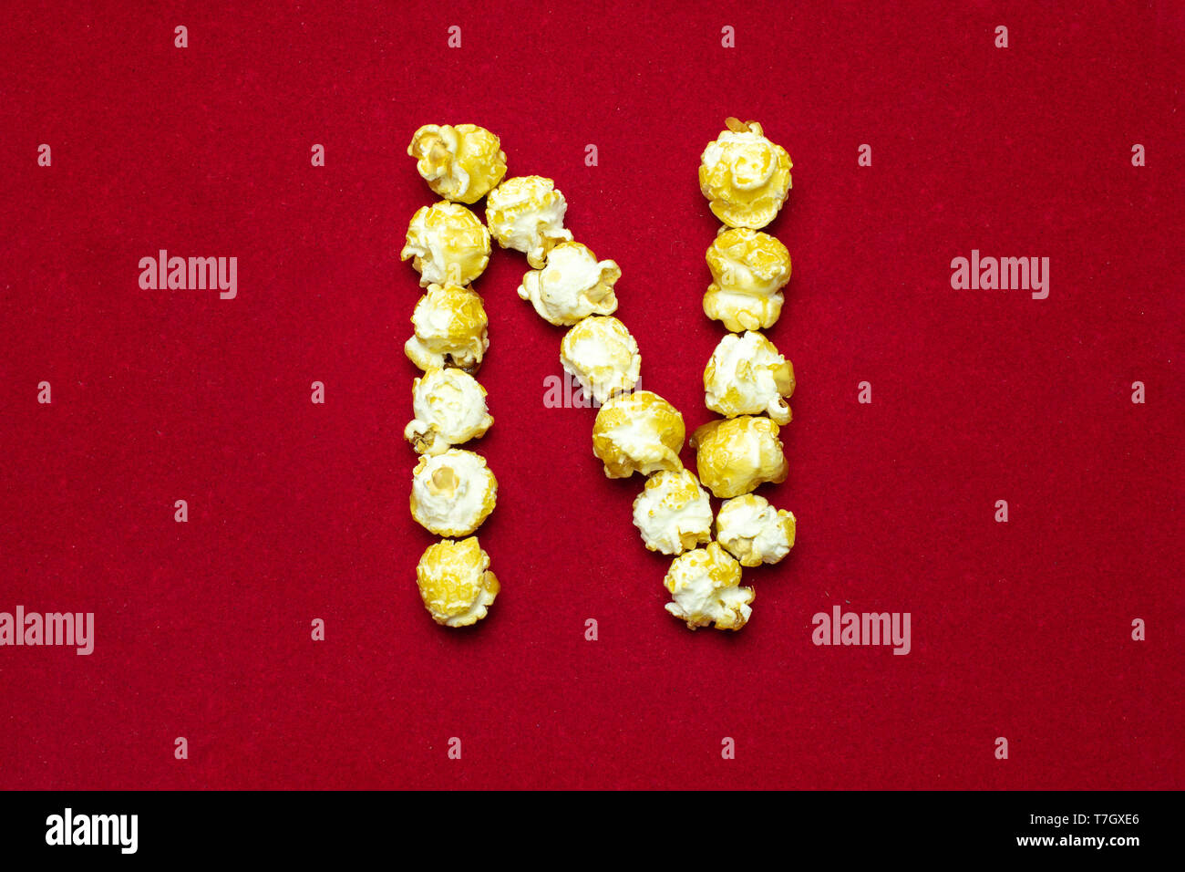 English alphabet from cinema popcorn. Letter N. Red background for ...