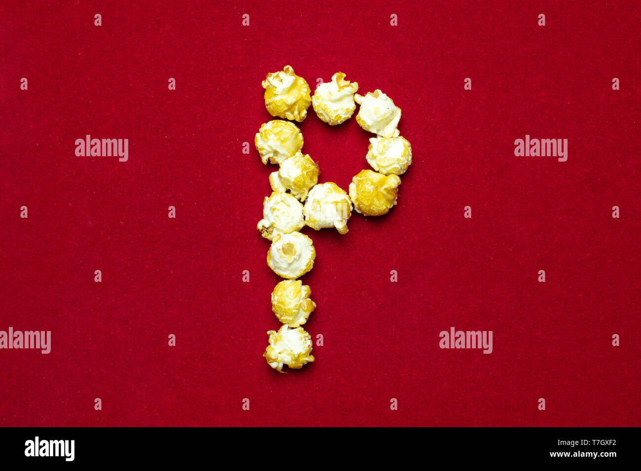 English alphabet from cinema popcorn. Letter P. Red background for ...