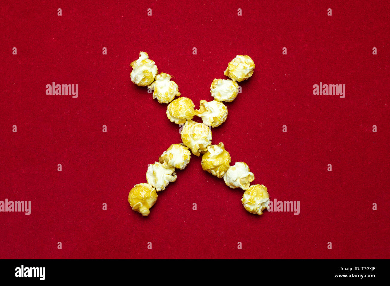 English alphabet from cinema popcorn. Letter X. Red background for ...