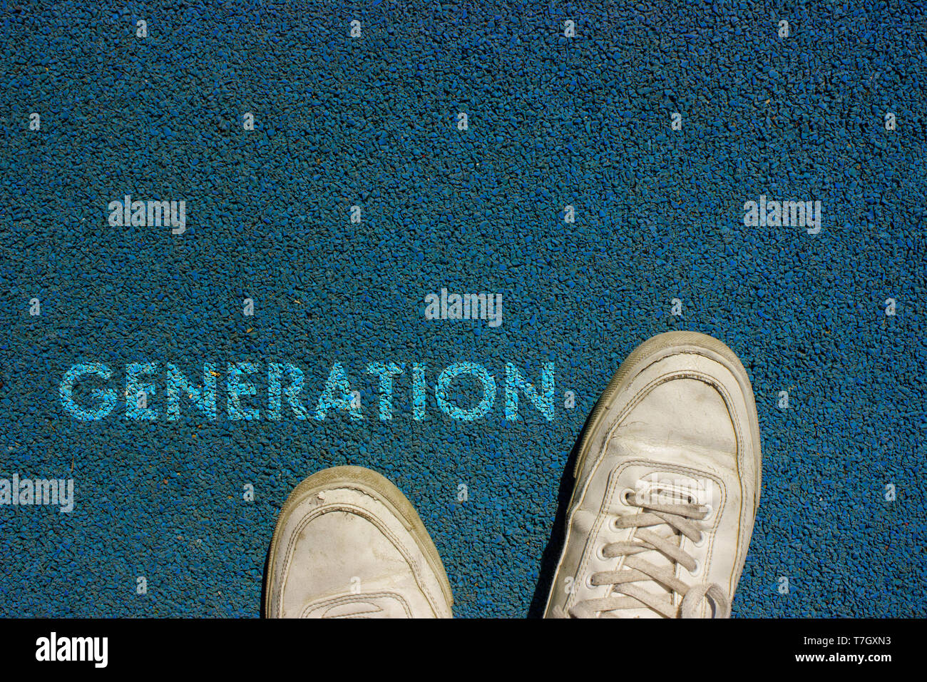 New life concept, Sport shoes and the word GENERATION written on blue ...