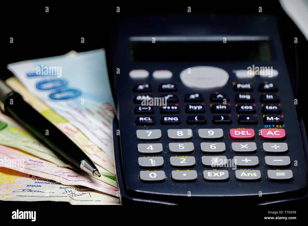 Turkish lira banknotes calculator bills and tax calculations on ...