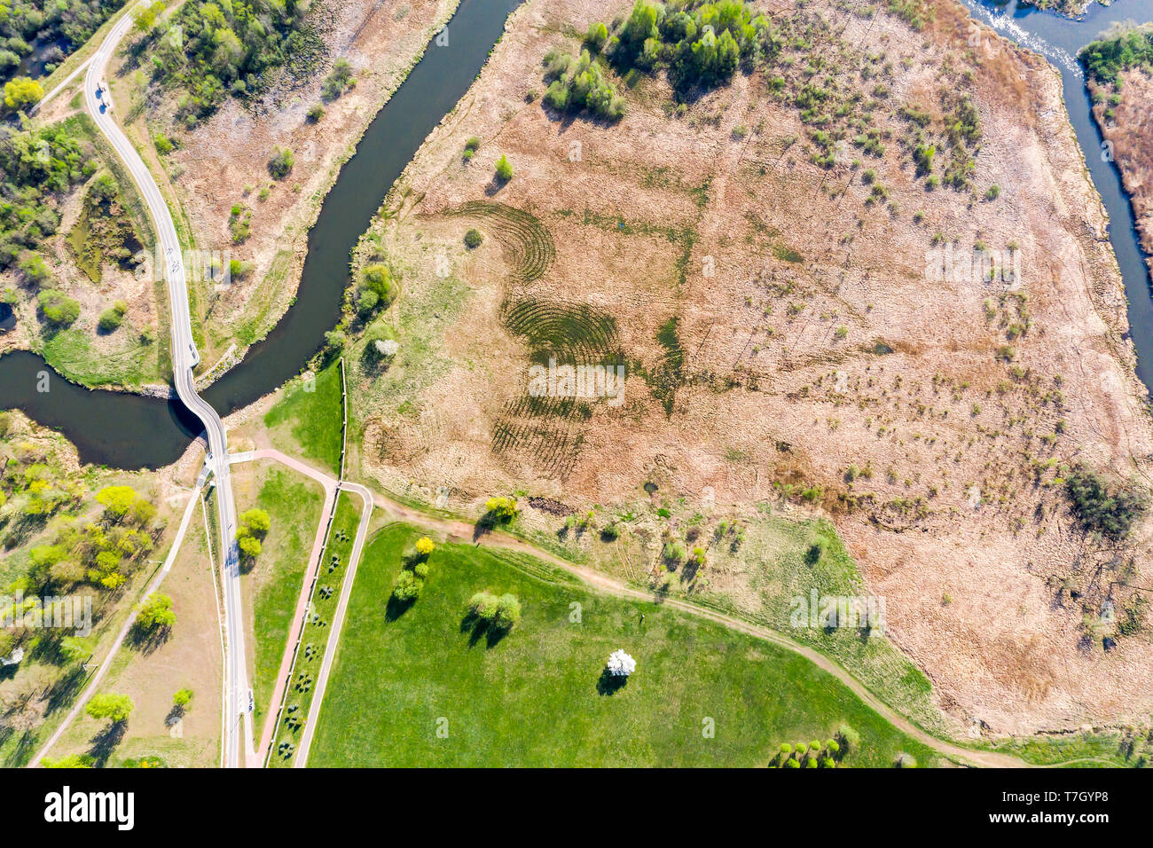 spring landscape with river, fields and bicycle lane among them. bird ...