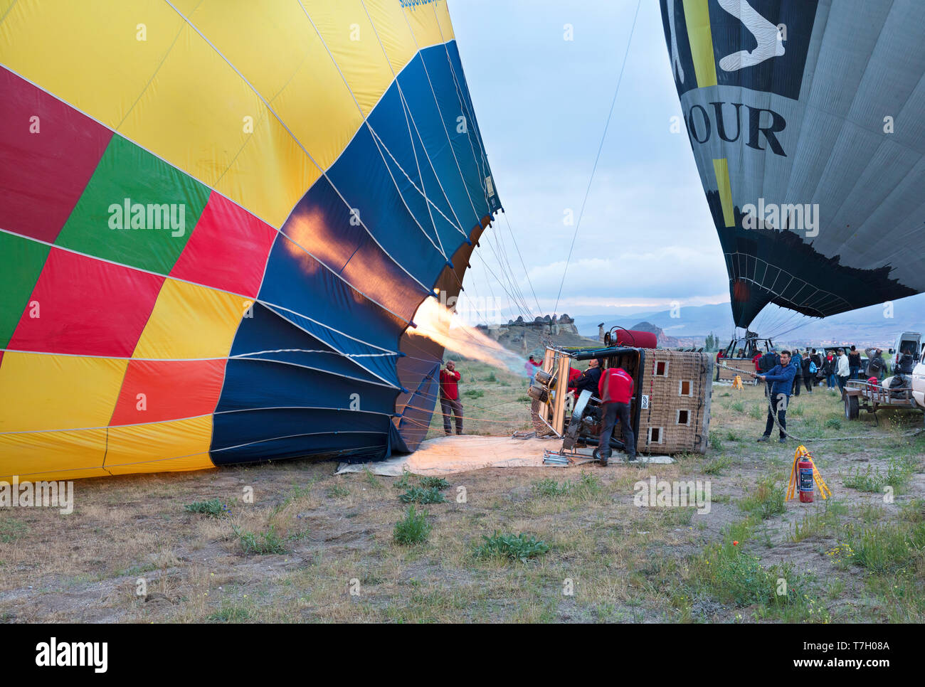 05.13.2018. Cappadocia, Goreme, Turkey. People inflate balloons with a ...