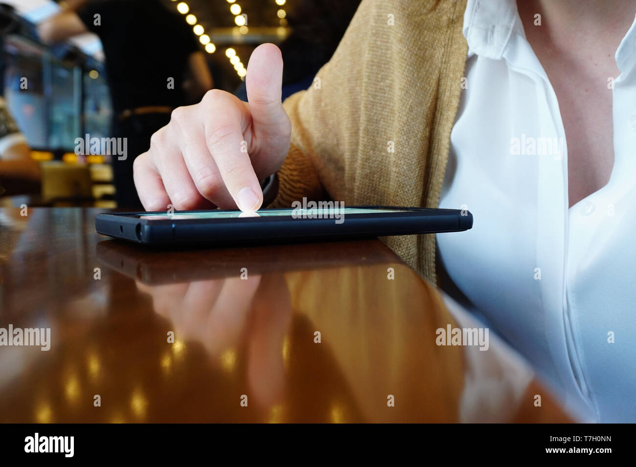 Touching the smartphone screen with finger Stock Photo - Alamy