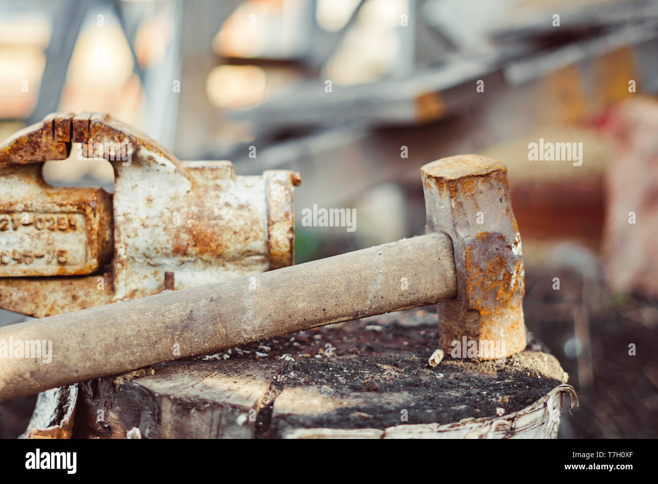Close up on a red tabletop mounted vise grip with screw action grip and ...