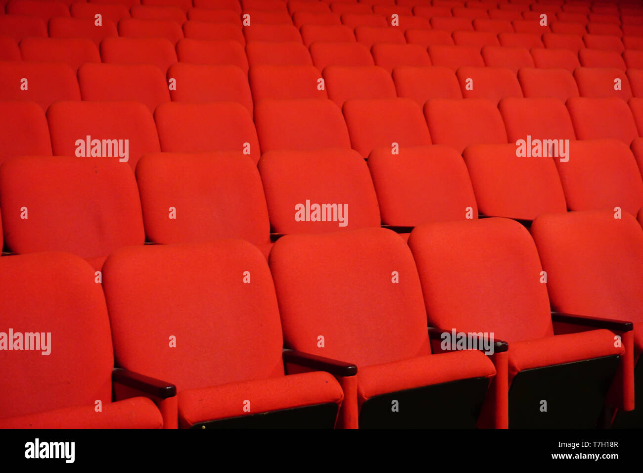 Red theater seats in a row Stock Photo - Alamy